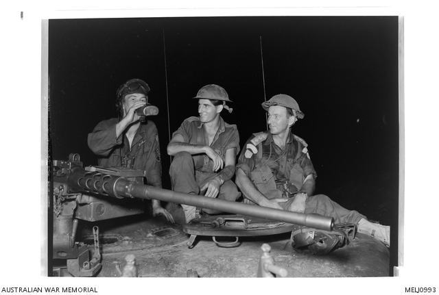 An American and two Australians from the 1st Battalion, The Royal ...