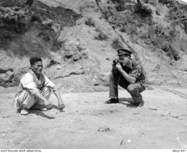 A Korean in a contemplative mood is photographic material for 'shutterbug' Warrant Officer Class ...