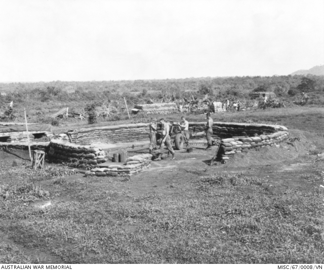 Nui Dat, South Vietnam. 1967. Four gunners with a 105mm pack howitzer ...