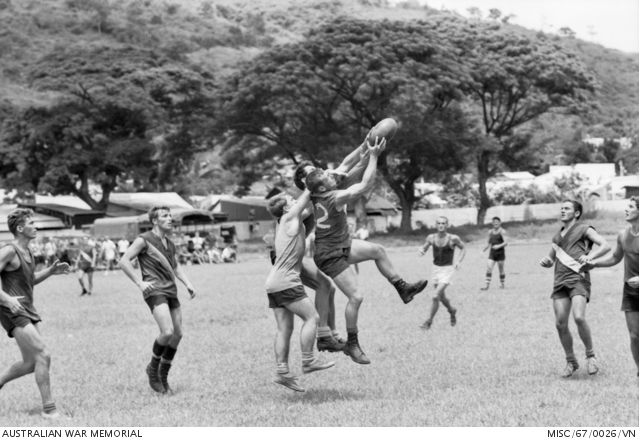 Vung Tau, South Vietnam. 1967-10. Players competing for the football in ...