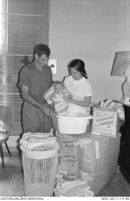 Signaller Greg Krushka of New Norfolk, Tas, helps Rose Tintore as she ...