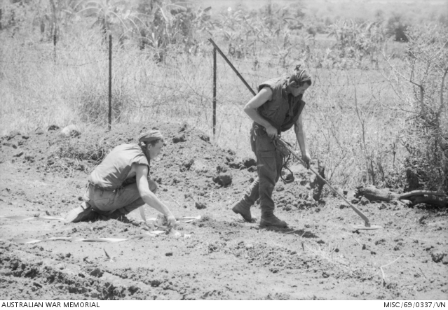 Two engineers from the 1st Field Squadron carry out one of the most ...