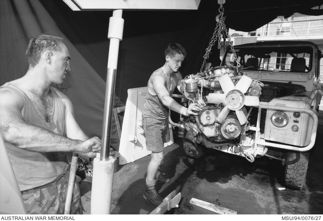 Two army mechanics work on the engine of an Australian United Nations ...