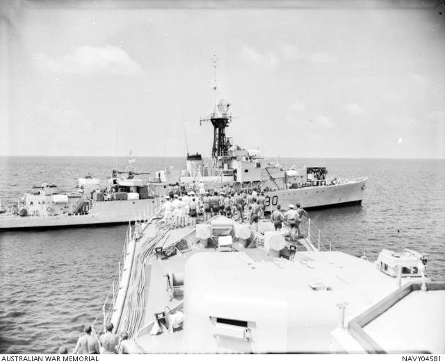 The Royal Navy Loch class frigate HMS Loch Fada (background) prepares ...