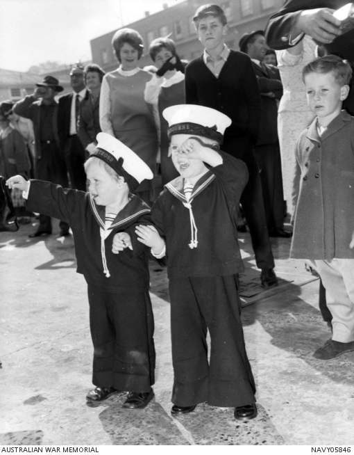 Twins Tania and Tony Dalby show their excitement as they wait for their ...