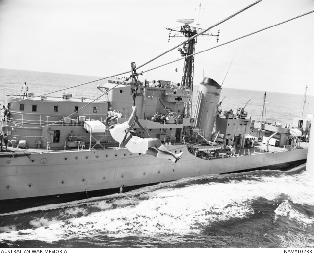 In a jackstay transfer at sea, Senior Chaplain G F Mayne, RAN returns ...