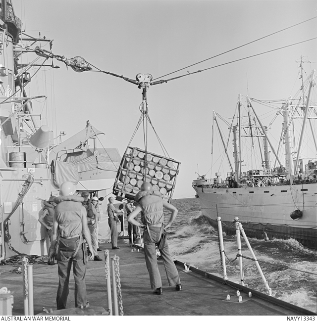 An ammunition party onboard the Guided Missile Destroyer HMAS Hobart ...