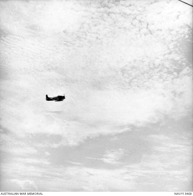 A US carrier-based Skyraider is observed from the Guided Missile ... A US carrier-based Skyraider is observed from the Guided Missile ...