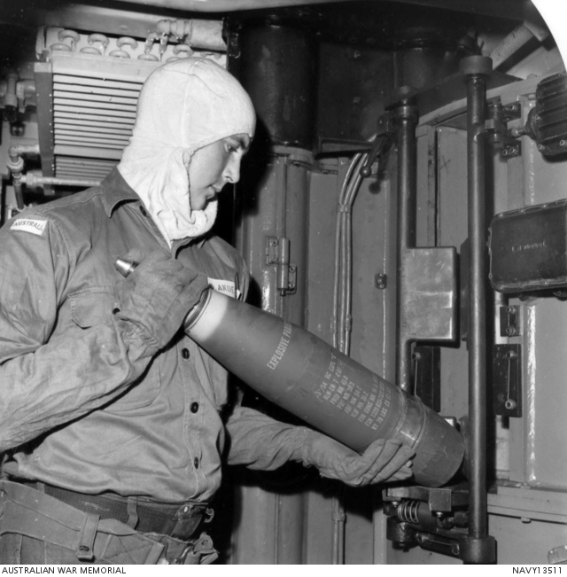 Ordinary Seaman Rick Anderson, R95080 loads a five-inch shell into the ...