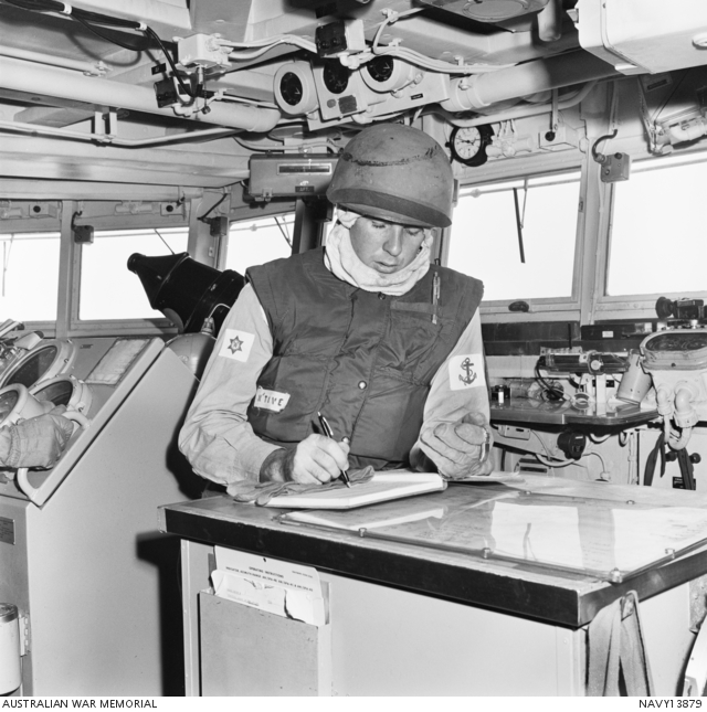 R54052 Leading Writer Robert Kevin Allen on watch at the chart table ...