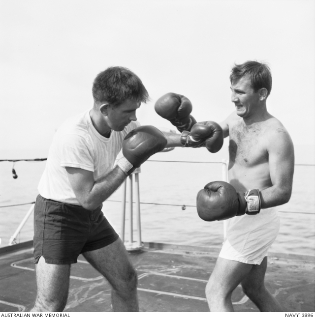R56755 Leading Seaman Sick Berth Attendant J B Rae (left) spars with ...