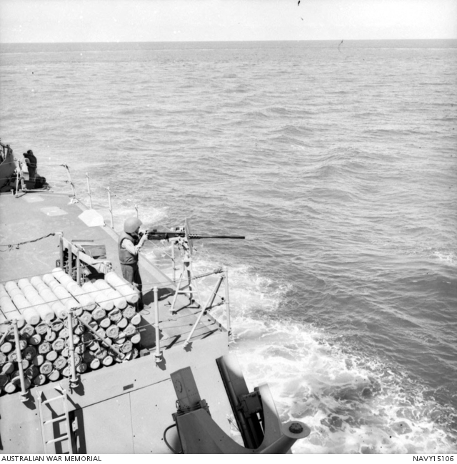 A crew member of the RAN guided missile destroyer HMAS Perth (II) D38 ...