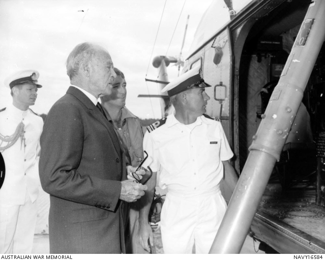 Lord Casey, Governor General of Australia (front, left), is shown a ...