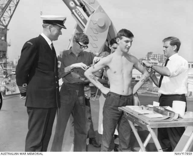 On board HMAS Perth (II) D38, at Garden Island, NSW, crew members are ...