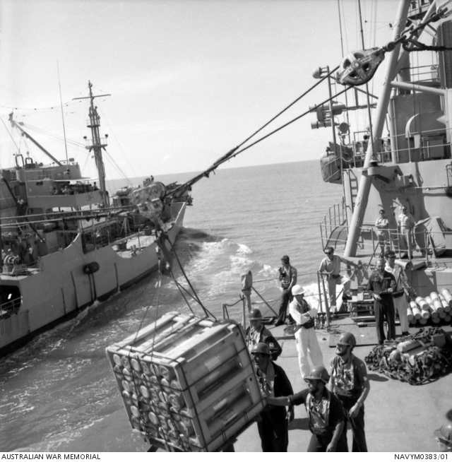 Crew members of the RAN destroyer HMAS Brisbane (II) D41 participate in ...