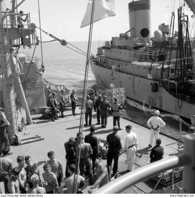 Crew members of the RAN destroyer HMAS Brisbane (II) D41 participate in ...