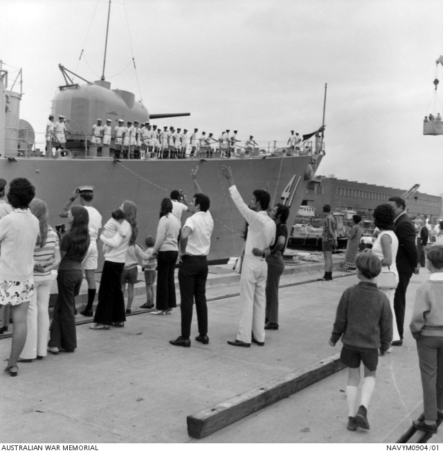 Crew members line the deck as the RAN guided missile destroyer HMAS ...