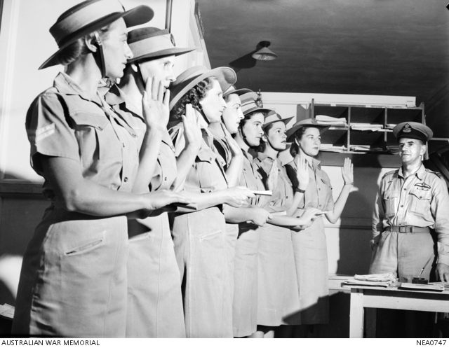 1944-05-31. WAAAF enlistments swearing the oath on the bible in front ...