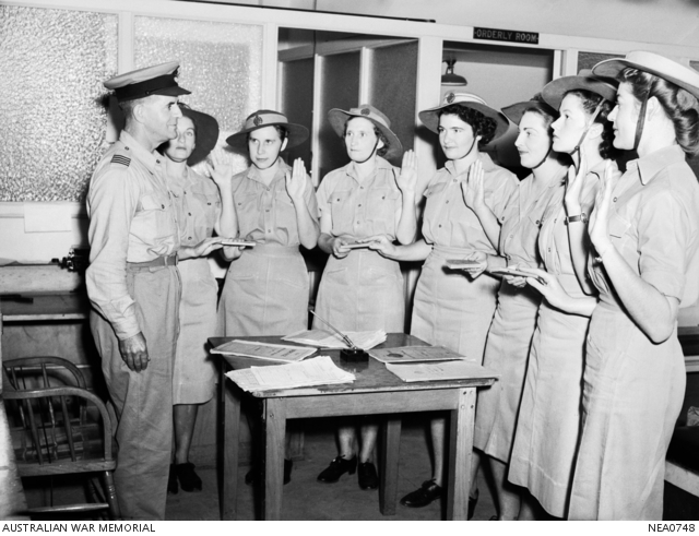 1944-05-31. WAAAF enlistments swearing the oath on the bible in front ...