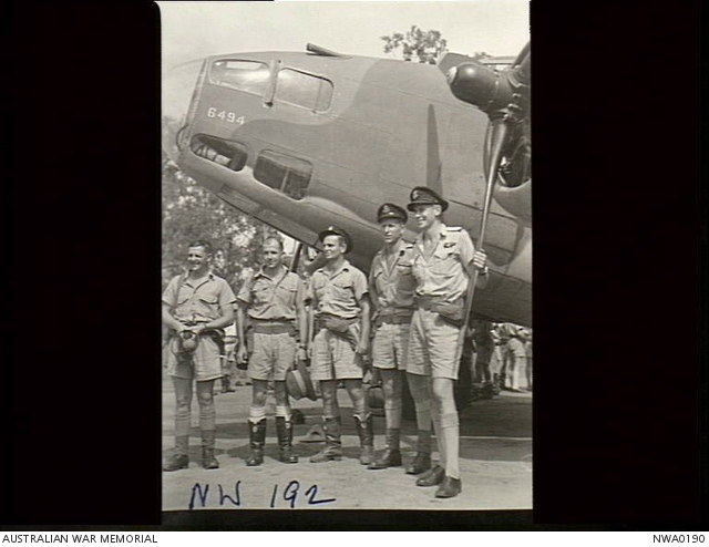 A crew of No. 2 Squadron RAAF standing alongside a Squadron Lockheed ...