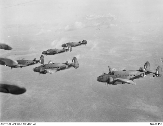 Darwin area, NT. c. 1943. A flight of Lockheed Hudson aircraft flying ...