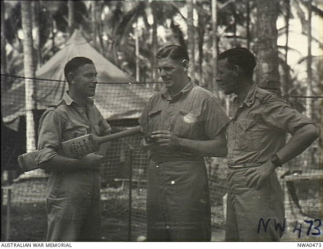 Darwin area, NT. c. 1943. Members of the RAAF discuss some tactics ...