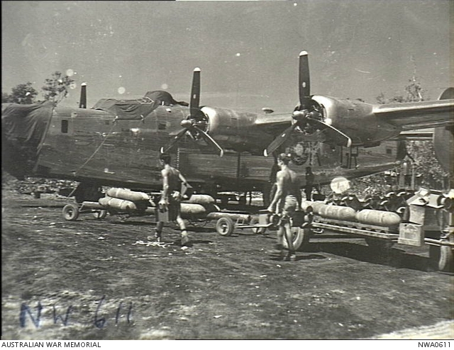 Manbulloo, NT. c. September 1944. Trolley loads of 300lb bombs ...