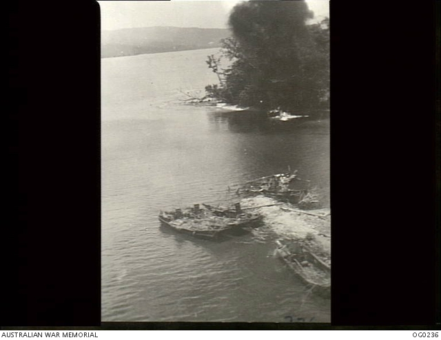 NEW BRITAIN. C. 1943-12-09. AERIAL PHOTOGRAPH OF FIVE JAPANESE BARGES ...