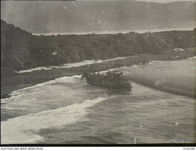 NEW BRITAIN. C. 1943-12-09. AERIAL PHOTOGRAPH OF A JAPANESE BARGE WHICH ...