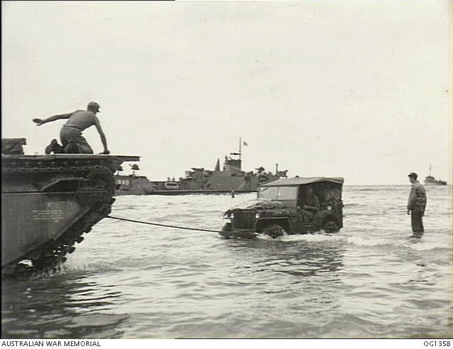 NOEMFOOR ISLAND, DUTCH NEW GUINEA. 1944-07-03. A RAAF JEEP BEING HAULED ...