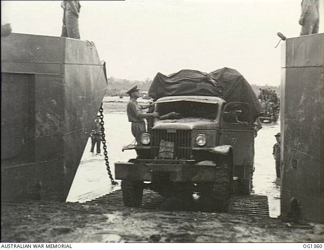 NOEMFOOR ISLAND, DUTCH NEW GUINEA. 1944-07-03. A RAAF TRUCK IS UNLOADED ...