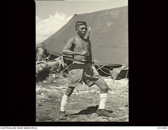NOEMFOOR ISLAND, DUTCH NEW GUINEA. C. 1944-07. PORTRAIT OF A LOCAL ...