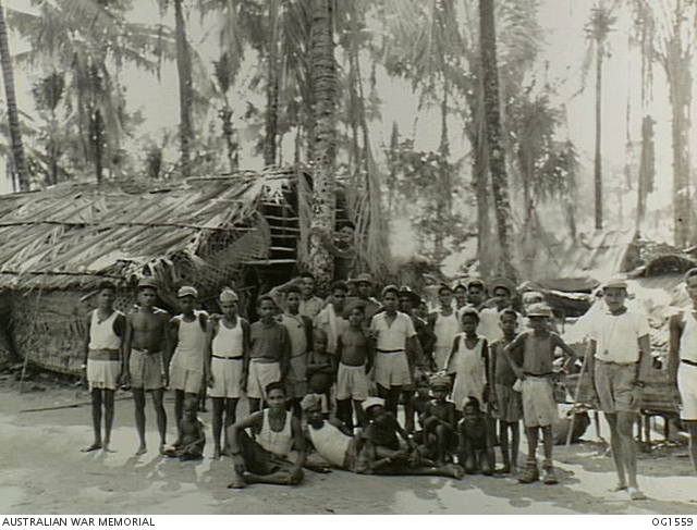NOEMFOOR ISLAND, DUTCH NEW GUINEA. 1944-08-28. NATIVES OUTSIDE THEIR ...