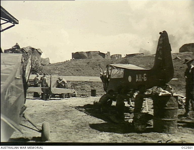 TARAKAN ISLAND, BORNEO. 1945-05-02. GROUND STAFF PREPARING AN AUSTER ...