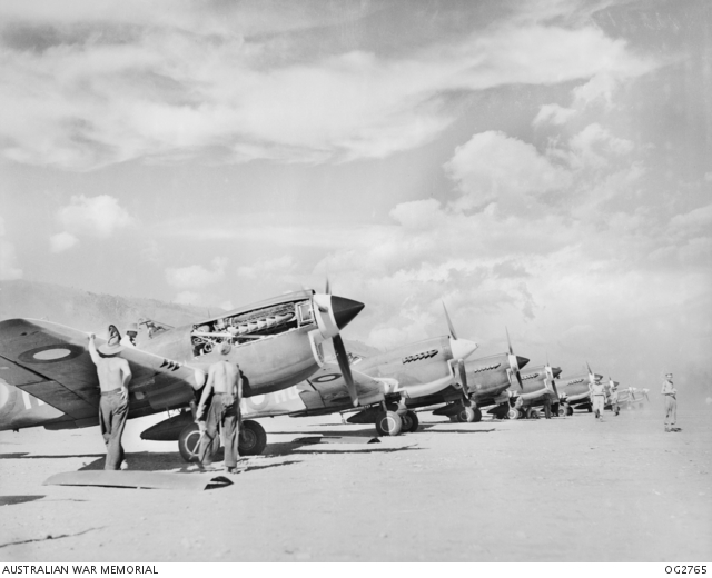 HOLLANDIA, DUTCH NEW GUINEA. C. 1944-06. LINE UP OF KITTYHAWK AIRCRAFT ...
