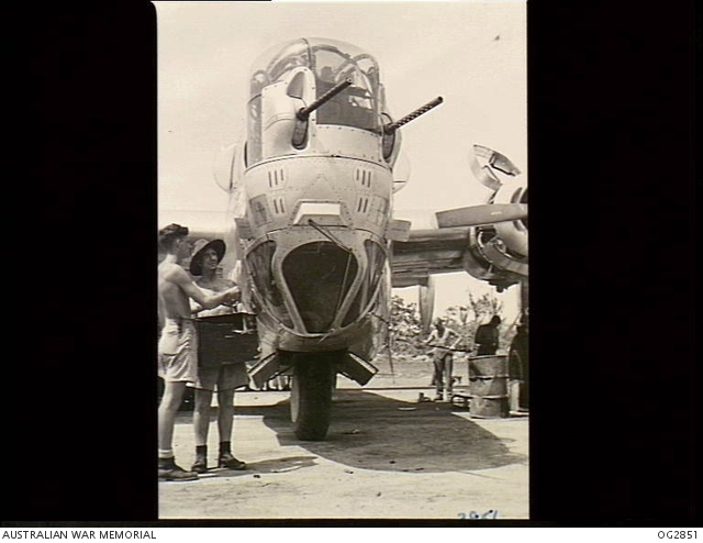 PALAWAN ISLAND, PHILIPPINES. 1945-06. REMOVING SPENT SHELLS FROM A ...