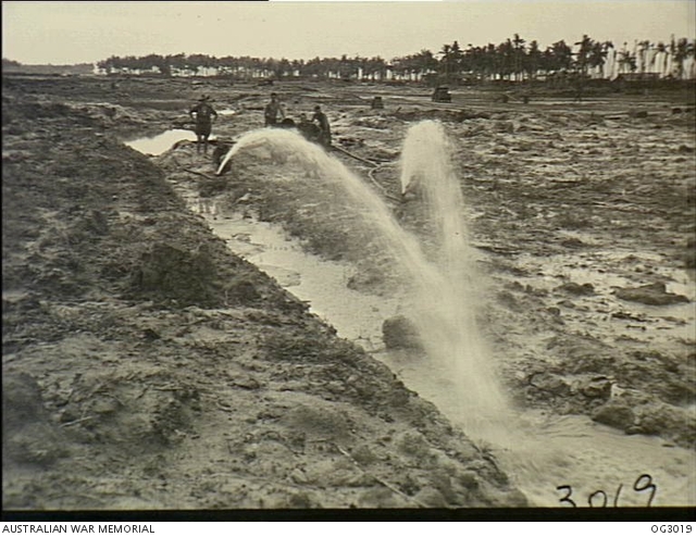 BALIKPAPAN, BORNEO. 1945-07-07. PUMPING OPERATIONS IN FULL SWING ...