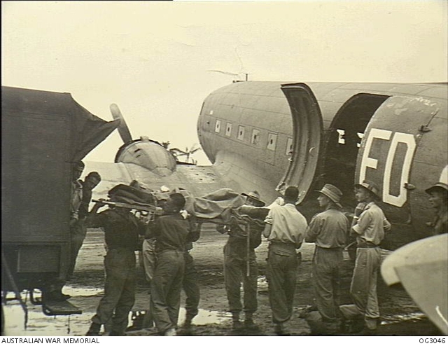 BALIKPAPAN, BORNEO. 1945-07-15. WOUNDED SOLDIERS BEING LOADED AT ...