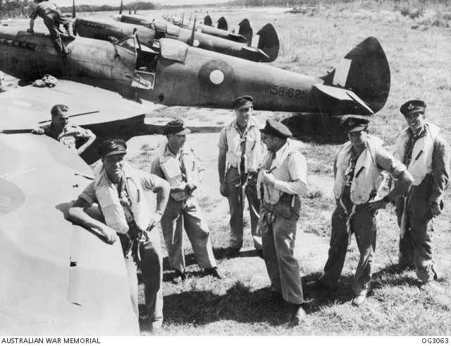 Unidentified pilots of No. 452 Squadron RAAF on the ground at Merauke ...