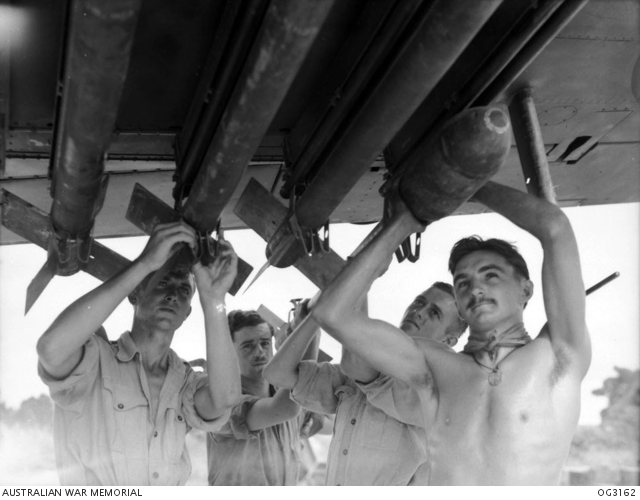 LABUAN, NORTH BORNEO. 1945-08-11. THESE ROCKETS BEING FITTED TO THE ...