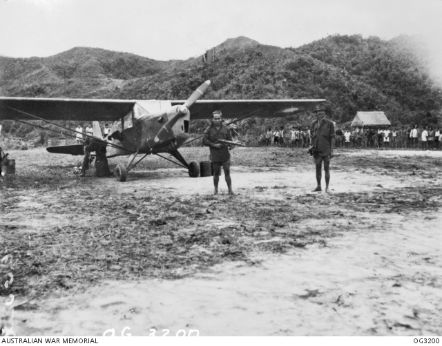 BORNEO. 1945-08-13. GUARDING ONE OF THE RAAF AUSTER AIRCRAFT OF NO. 16 ...