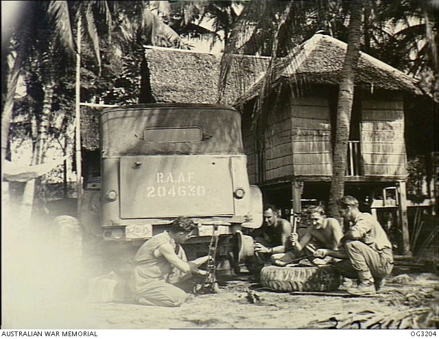 LABUAN, NORTH BORNEO. 1945-08-10. IN AN UNUSUAL SETTING, RAAF TRANSPORT ...