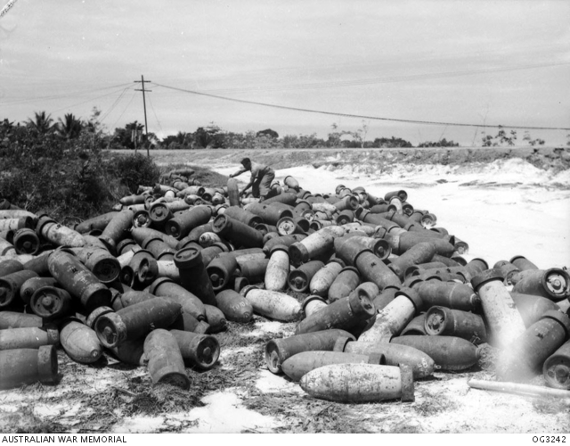 LABUAN, NORTH BORNEO. 1945-08-15. BOMBS THAT NO-ONE USED: THIS PILE OF ...