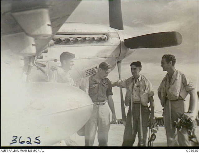 LABUAN, NORTH BORNEO. 1945-09-24. STANDING ON LABUAN AIRSTRIP, BESIDE ...