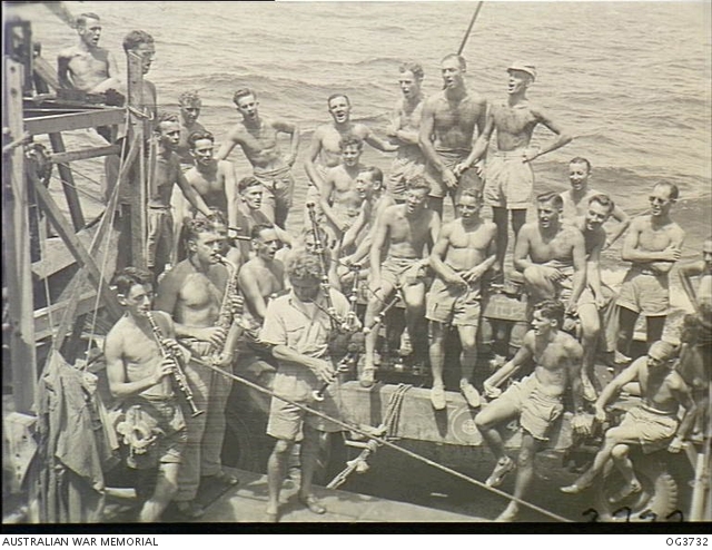 AT SEA EN ROUTE BORNEO TO SYDNEY, NSW. C. 1946-01-19. ASSISTED BY ...
