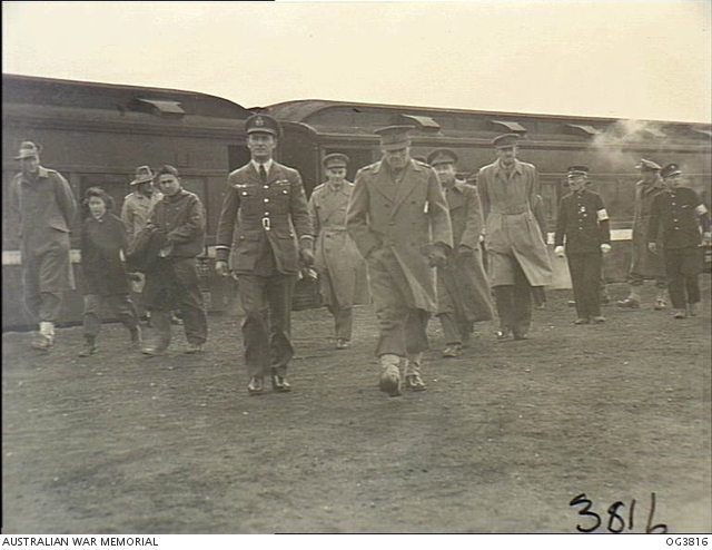 IWAKUNI, JAPAN. C. 1946-02-28. ON HIS WAY TO INSPECT RAAF QUARTERS AT ...