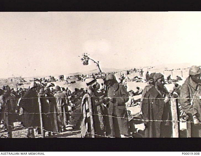 BIR EL MAZAR, SINAI. ?1916-09. TURKISH PRISONERS INSIDE A BARBED WIRE ...