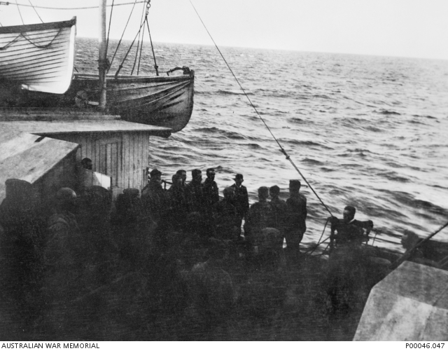 A service is performed on the deck of the troopship HMS Hororata prior ...