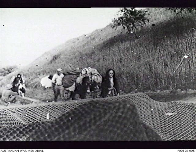 GREECE. 1941-04. GREEK CIVILIANS, THEIR BELONGINGS LOADED ON DONKEYS ...