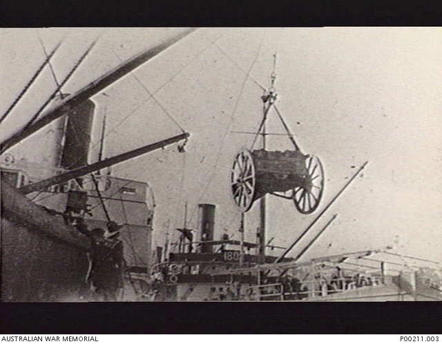 1915. A LIMBER BEING UNLOADED FROM A TROOP TRANSPORT SHIP. THIS WAS ...